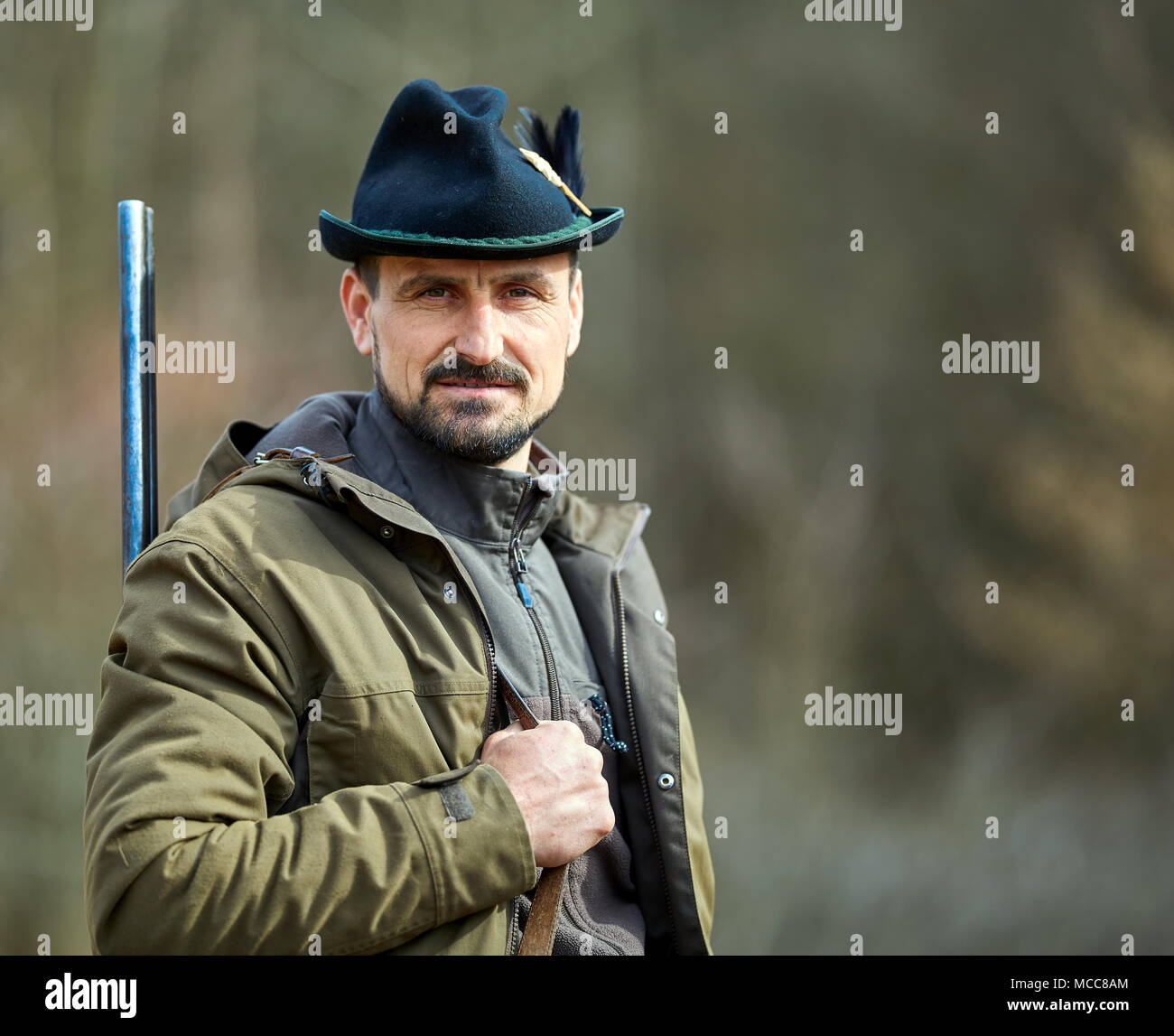 Hunter with double barrel gun in the forest looking for game Stock ...