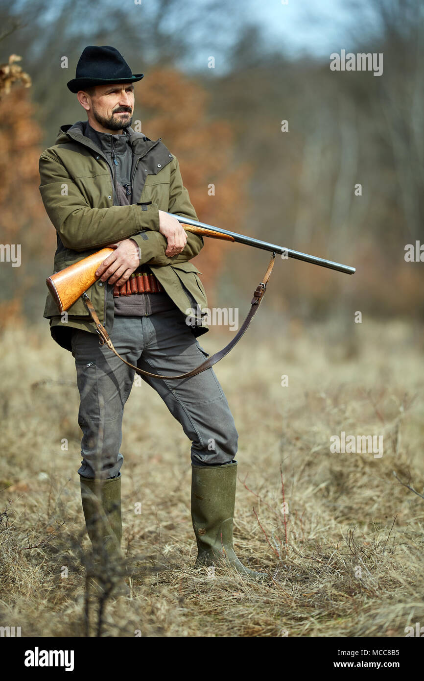Hunter with double barrel gun in the forest looking for game Stock ...