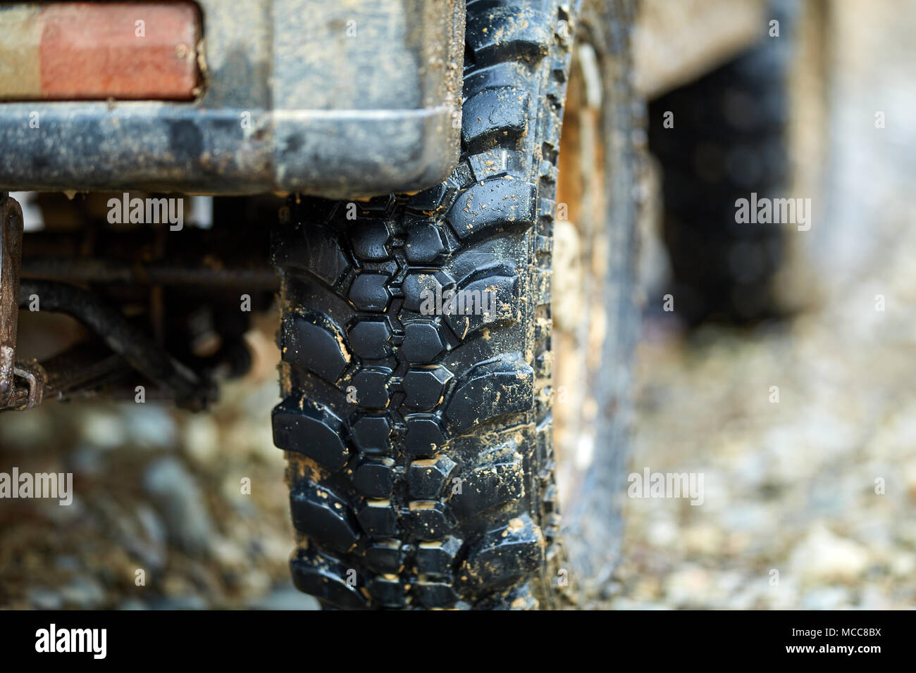 Closeup of an offroad car tyre in the mud Stock Photo - Alamy