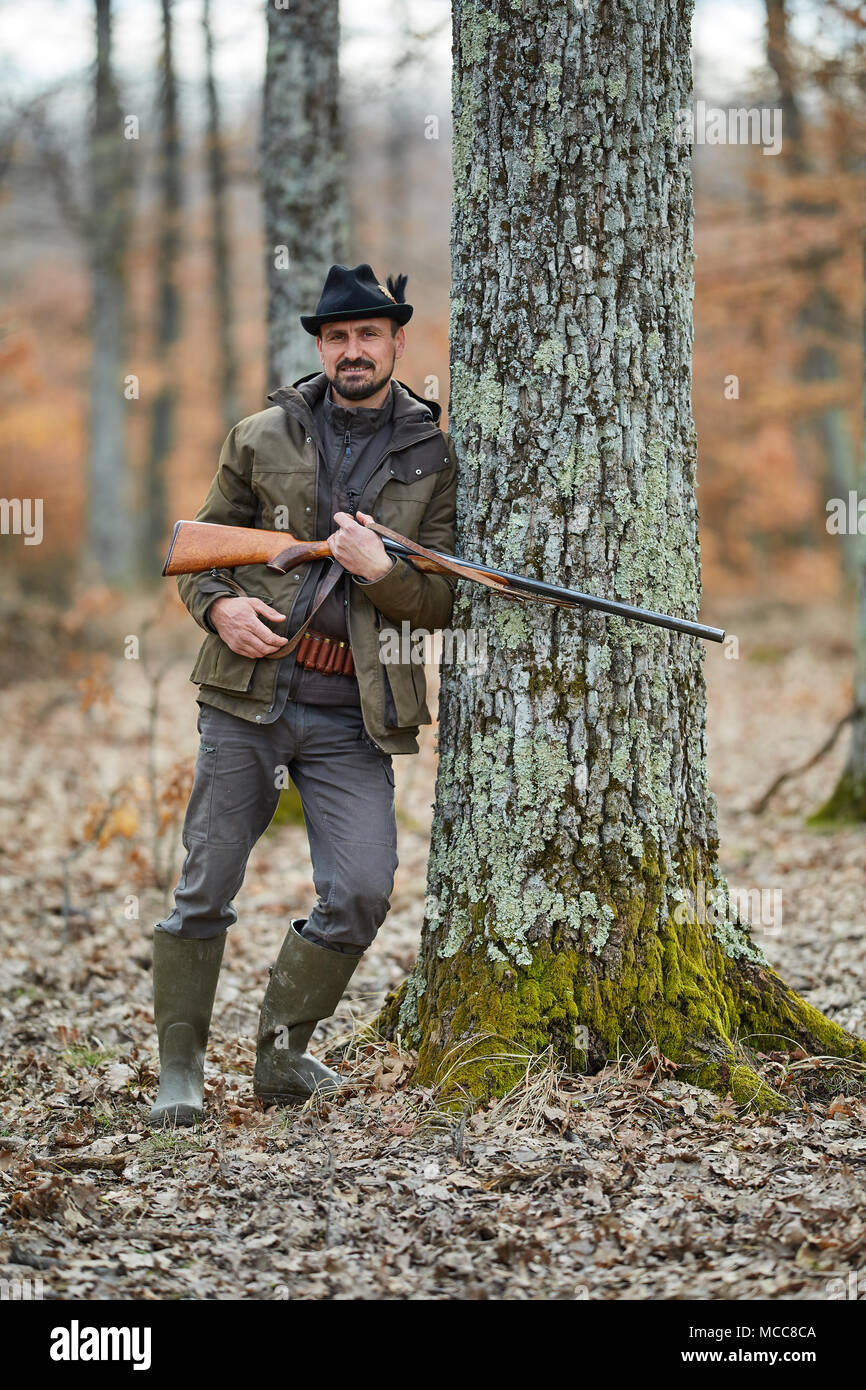 Hunter with double barrel gun in the forest looking for game Stock ...