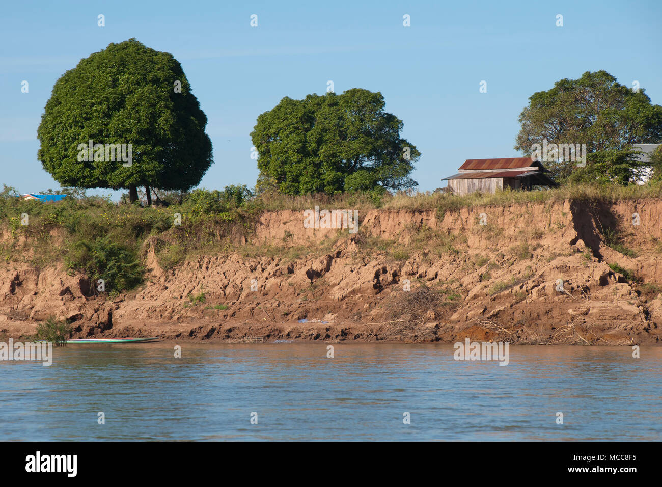 Mekong river Stung Treng province Cambodia, farm house on steep ...