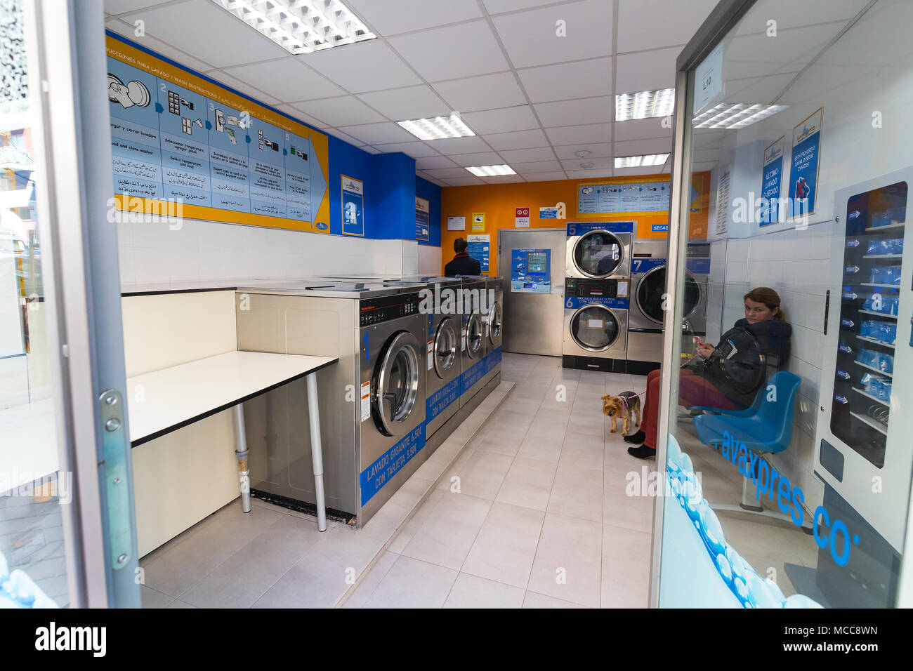 MADRID, SPAIN - 27 MARCH, 2018: Public laundry with mashinam for a ...