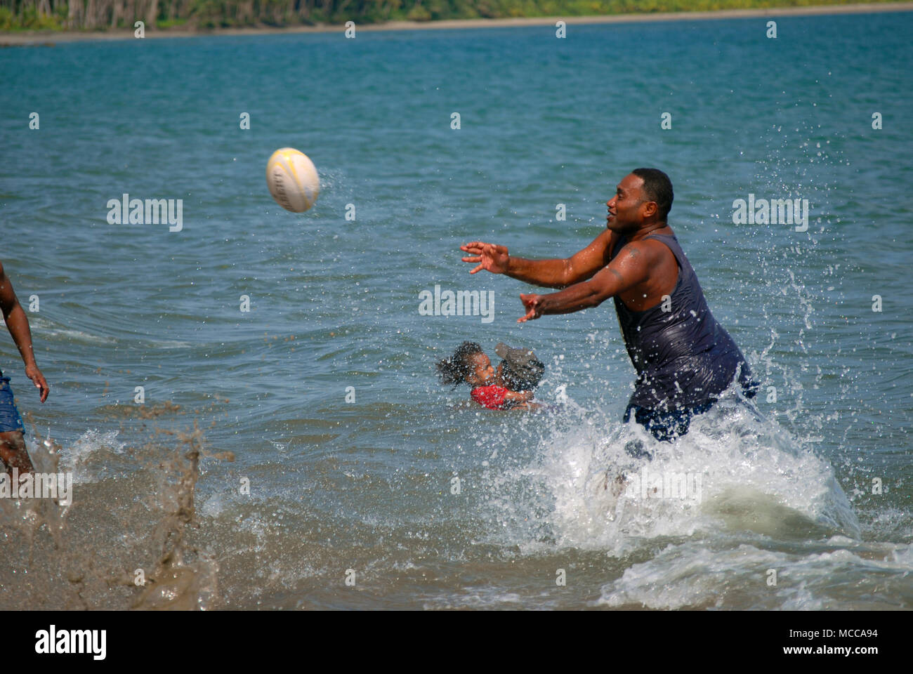 Fijian men playing rugby on Palm Beach, Pacific Harbour, Fiji Stock ...