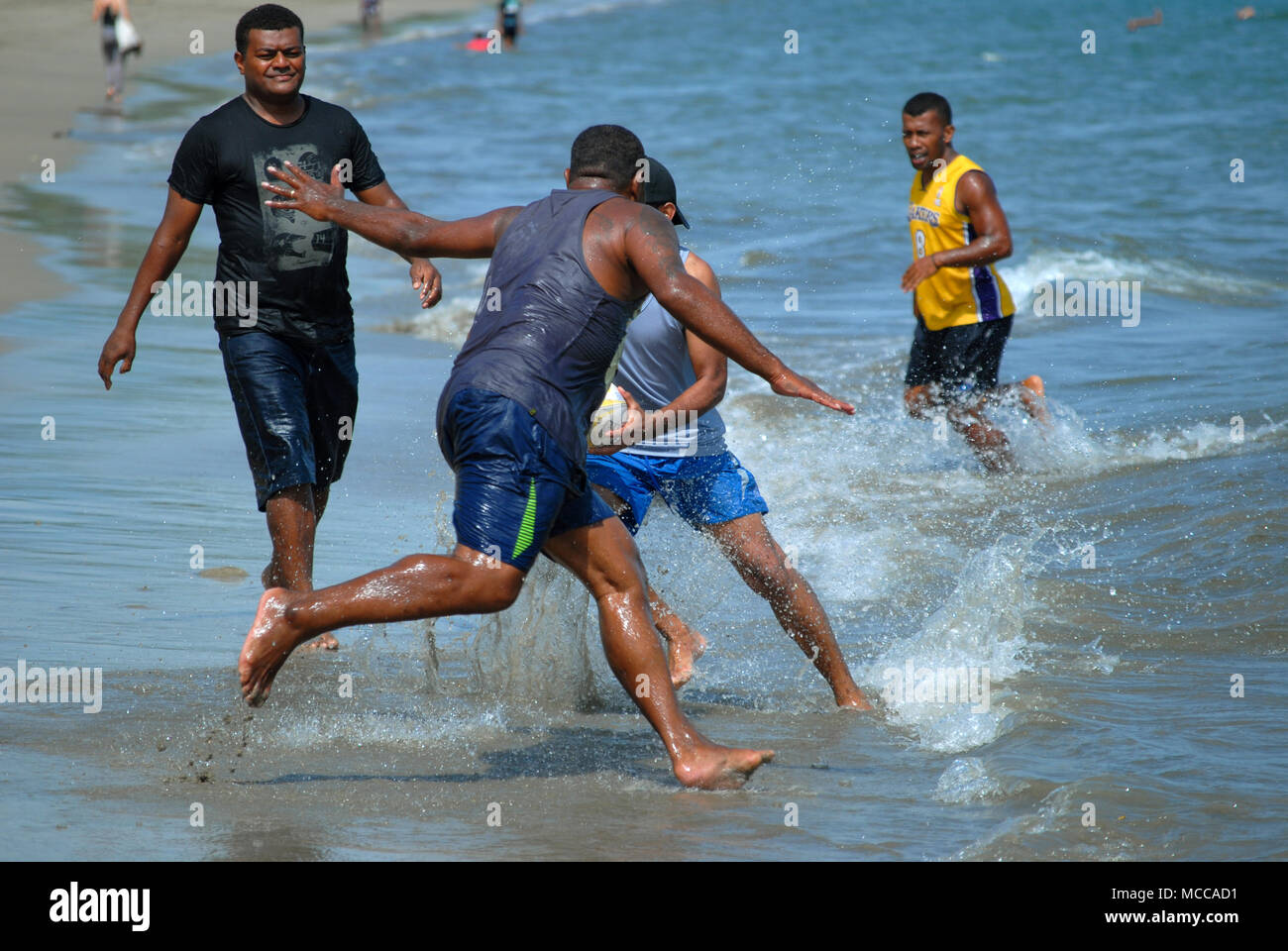 Fijian men playing rugby on Palm Beach, Pacific Harbour, Fiji Stock ...