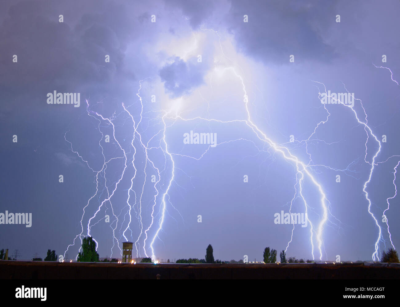 Lightning flash over a city, Thunderstorm , electricity blast storm ...