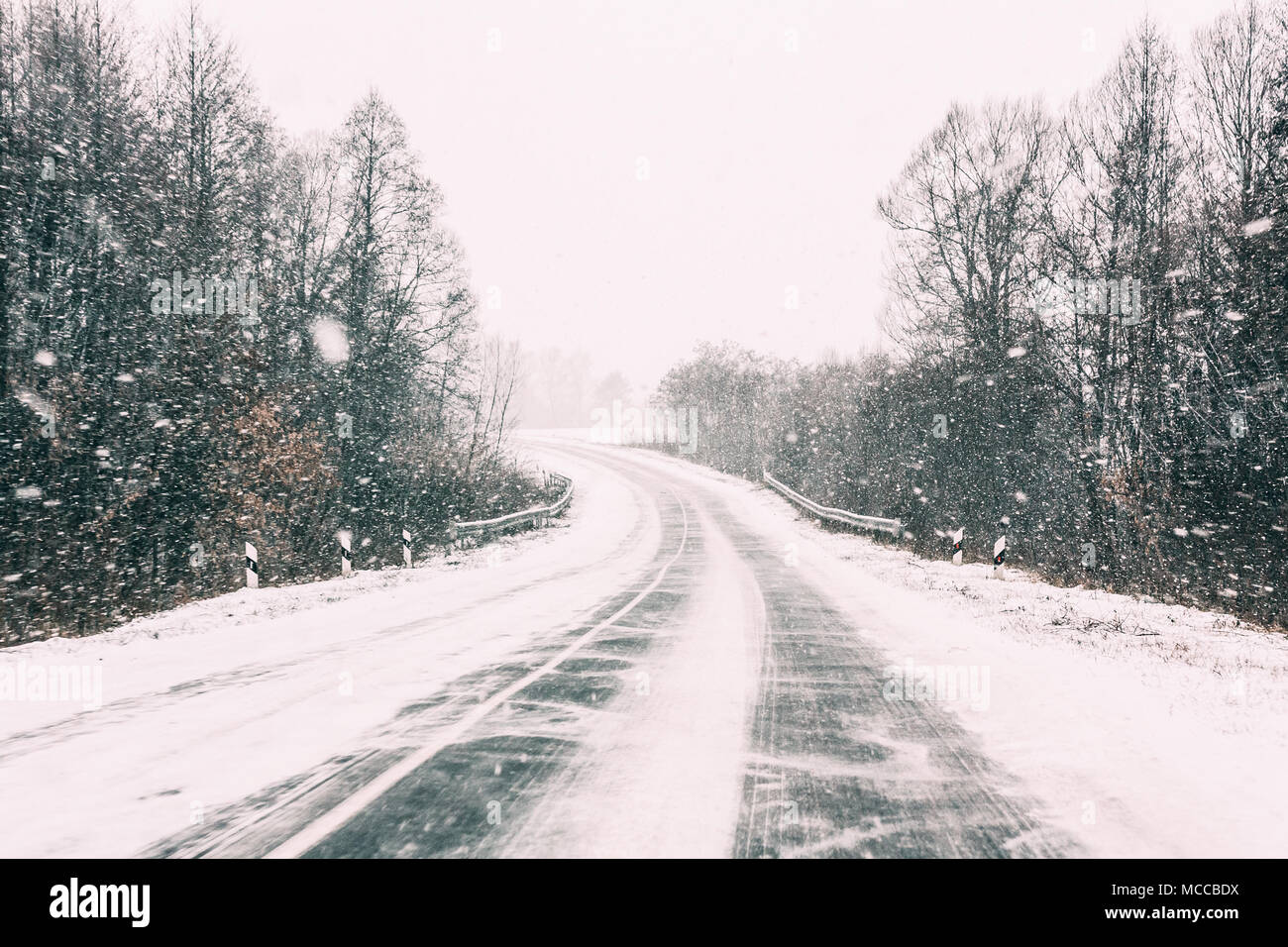 Snow-covered Open Road During A Winter Snowstorm. Adverse Weather ...
