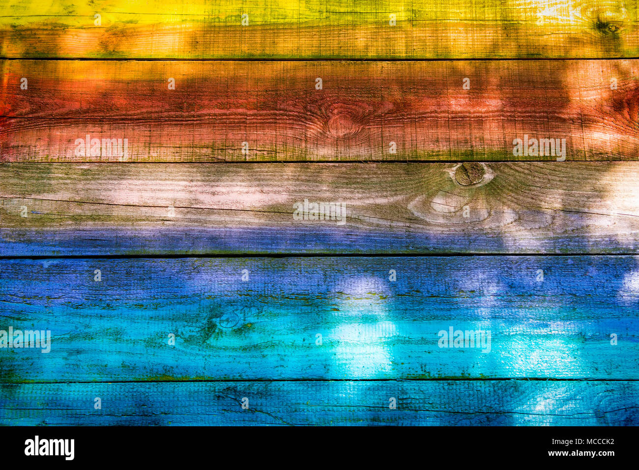 Wood plank naturally painted texture background with sun rays stains ...