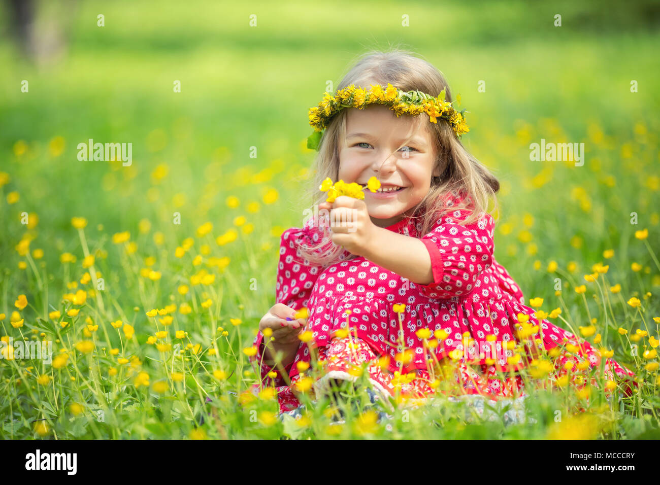 Little girl in spring park Stock Photo - Alamy