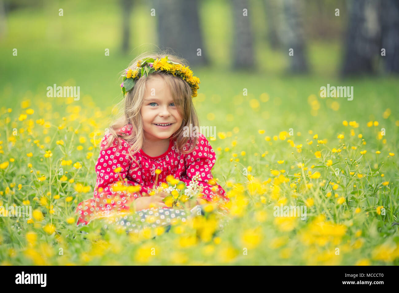Little girl in spring park Stock Photo - Alamy