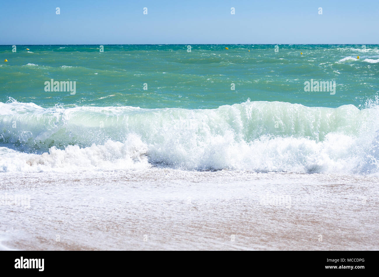 Waves breaking on a beach Stock Photo - Alamy