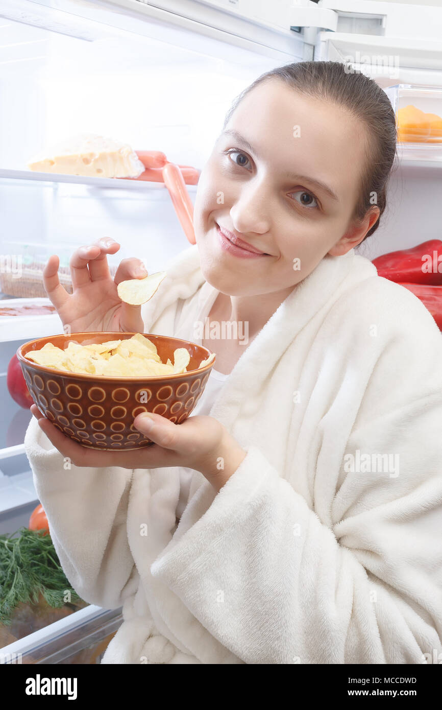 Attractive woman eating chips hi-res stock photography and images - Alamy