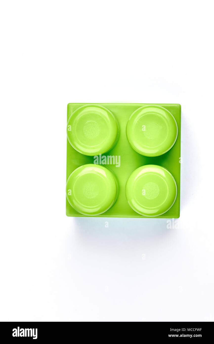 Plastic building block, white background. Kids constructor element ...