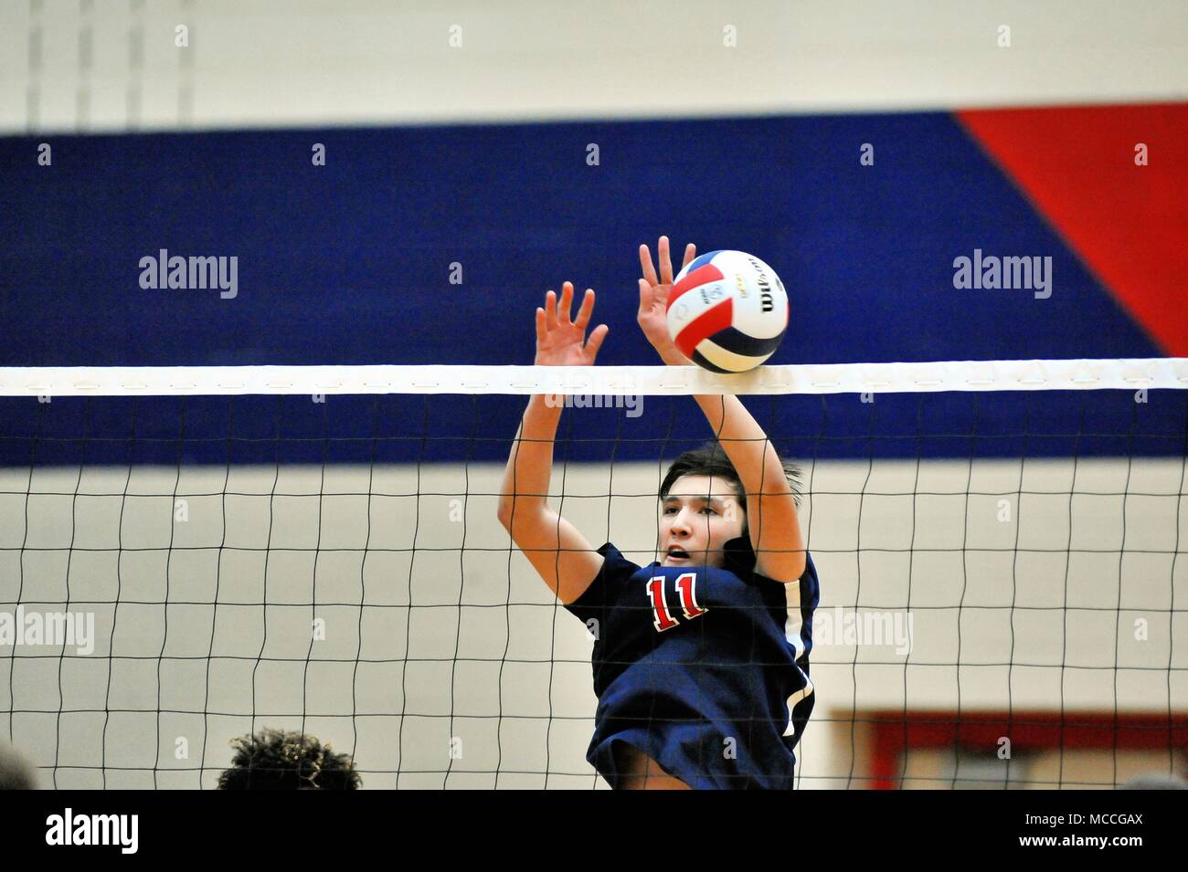 Player returning to the floor after a blocking an opponent's shot. USA ...