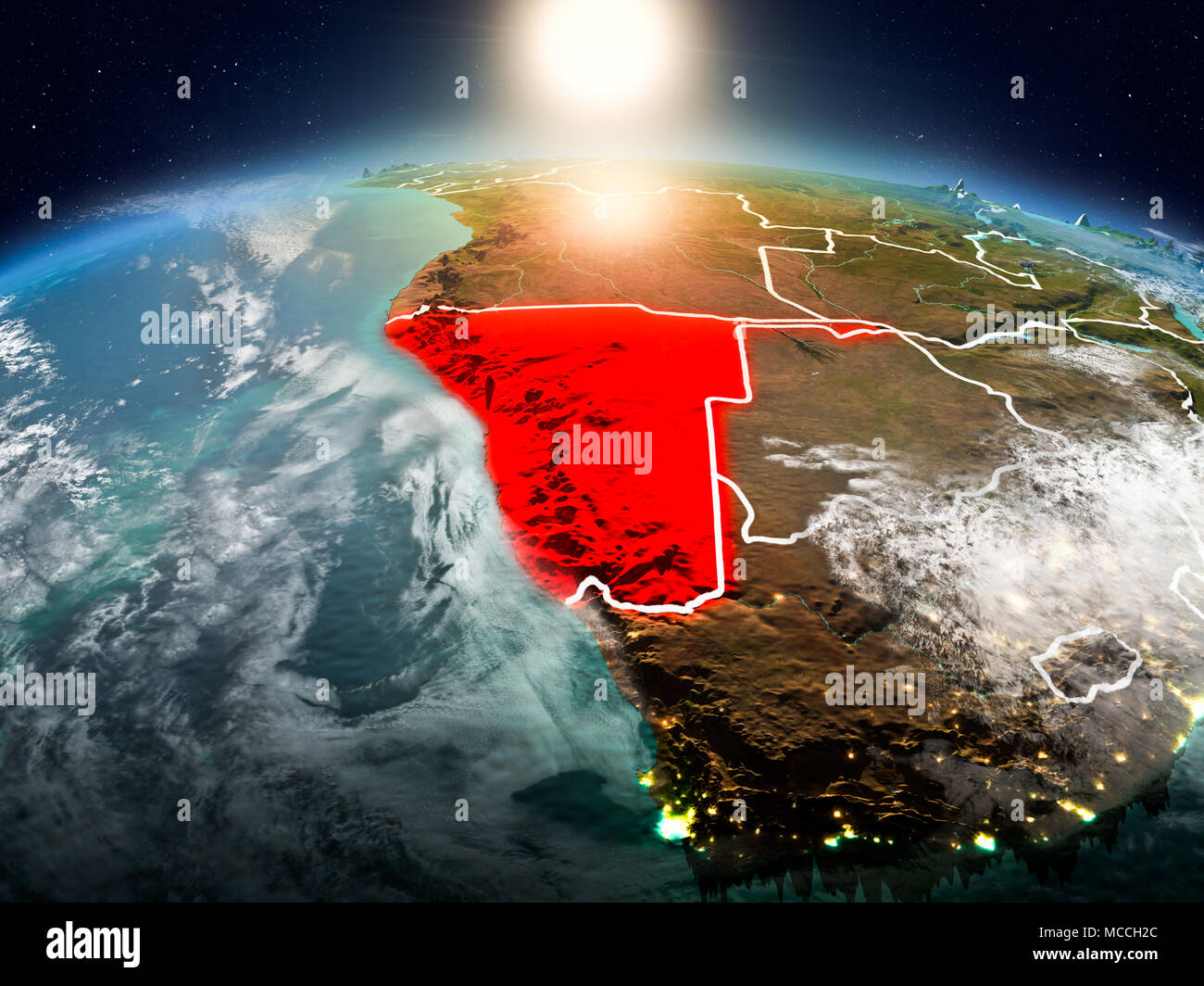 Sunrise above Namibia highlighted in red on model of planet Earth in space with visible country ...