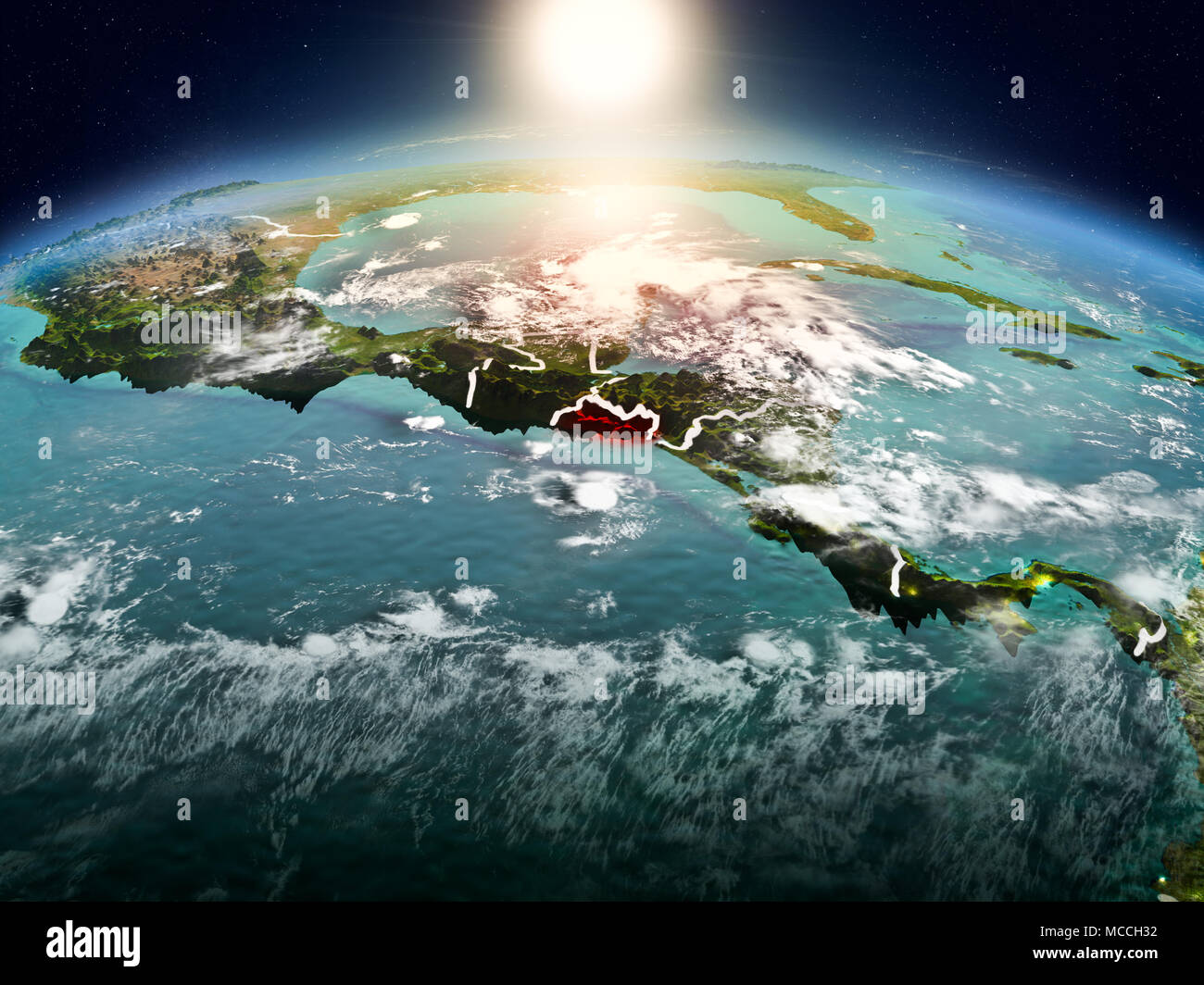 Sunrise above El Salvador highlighted in red on model of planet Earth in space with visible ...