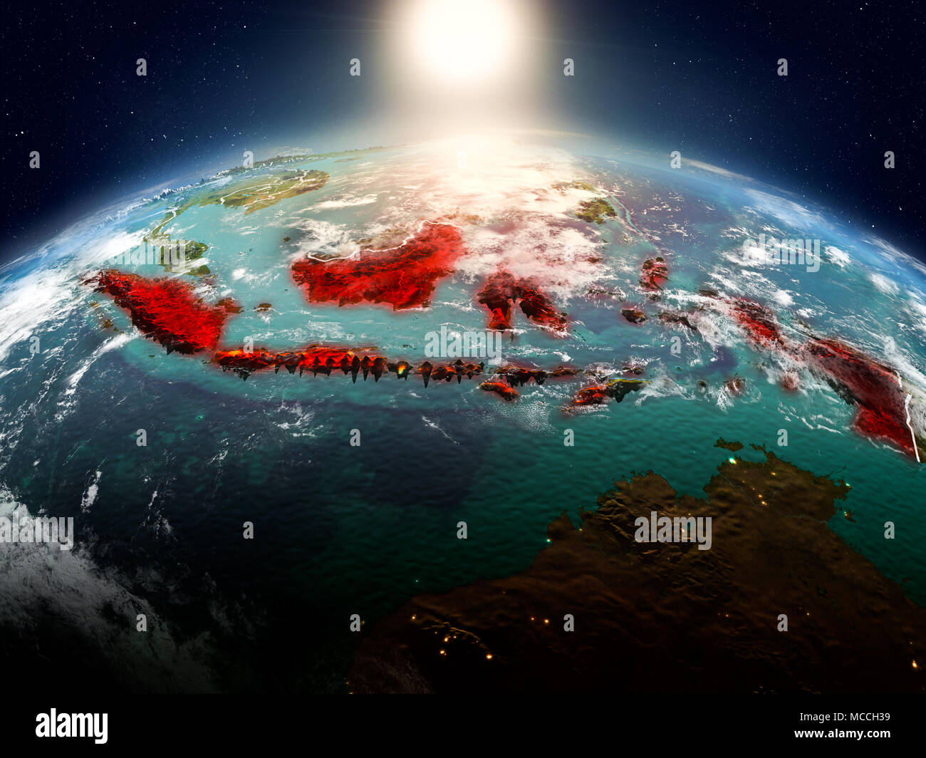 Sunrise above Indonesia highlighted in red on model of planet Earth in ...