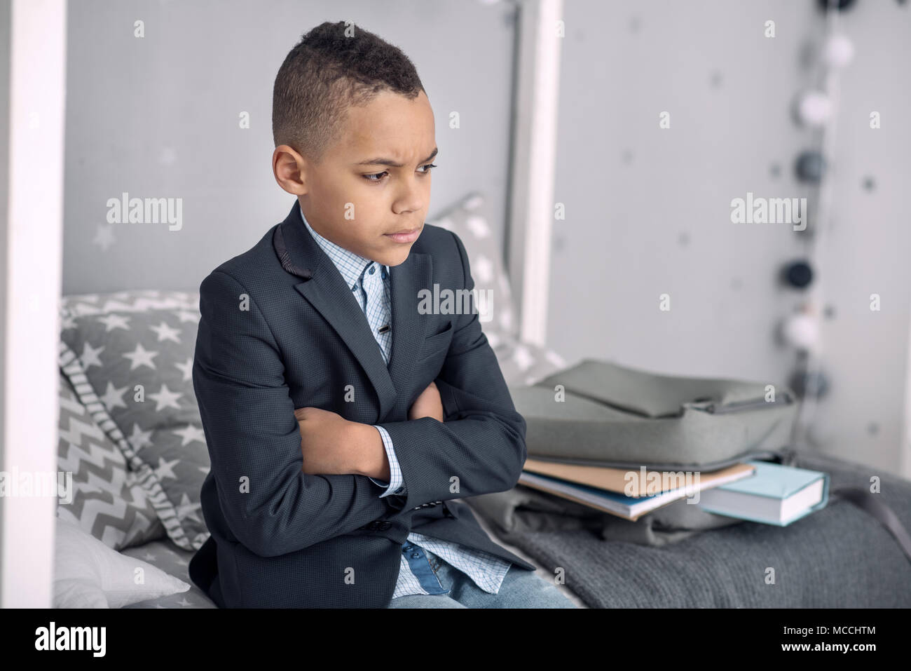 Mad unsatisfied boy tiring from school Stock Photo - Alamy