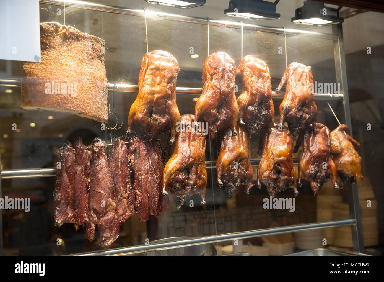Cooked ducks and other meats in restaurant windows, Chinatown, Soho ...