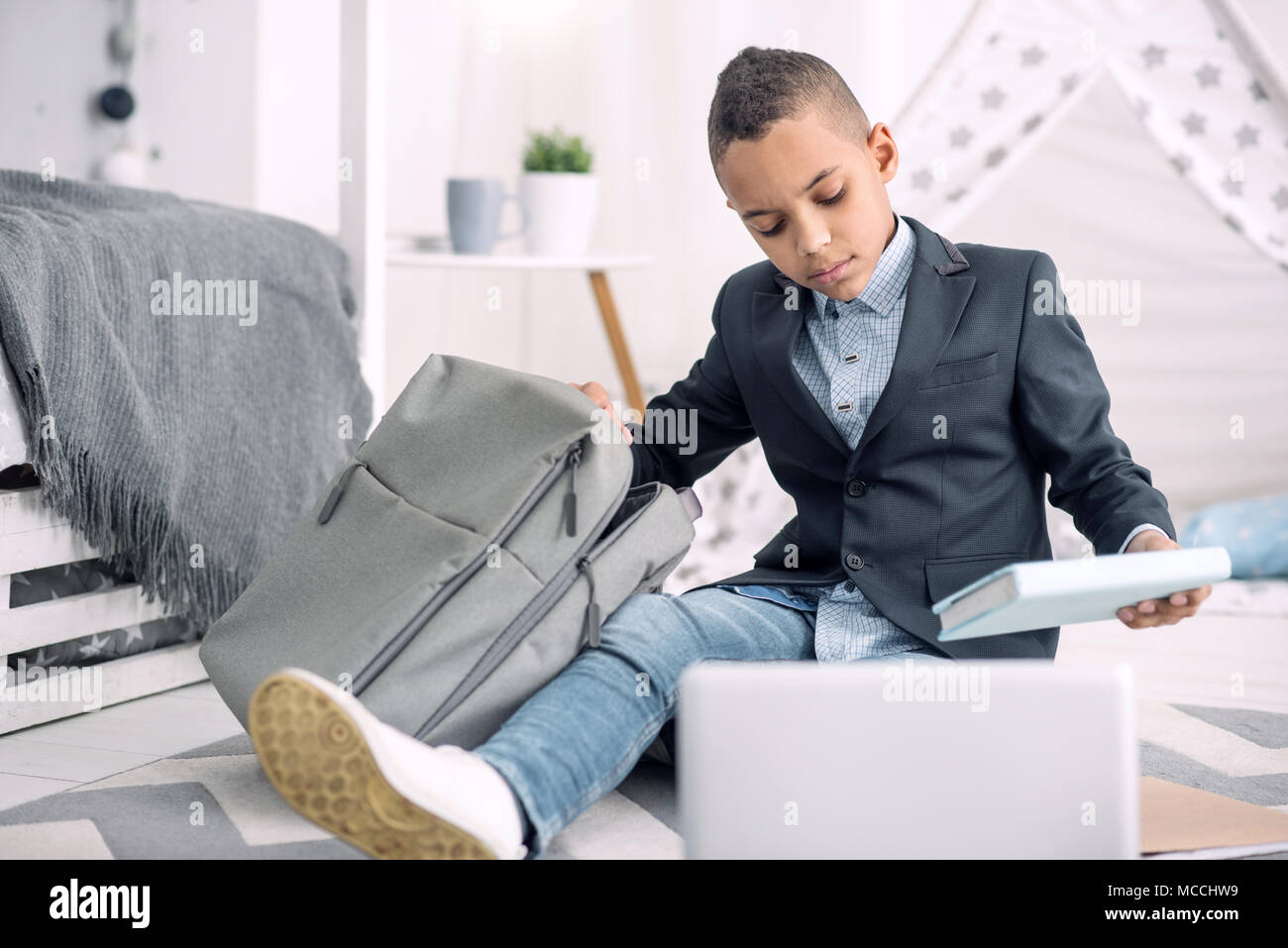 Boy packing hi-res stock photography and images - Alamy