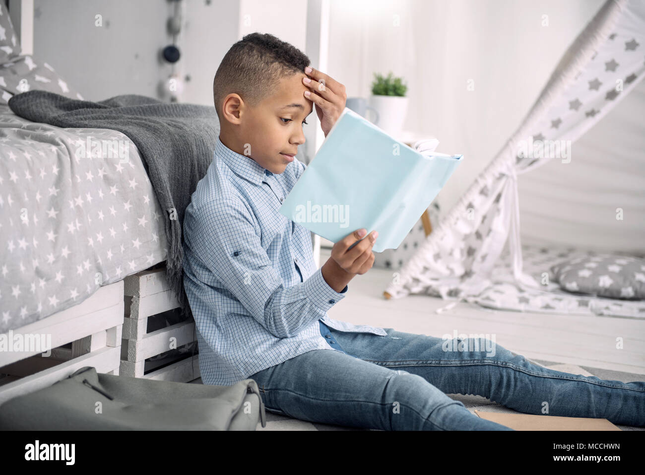 Worried disturbed boy studying math Stock Photo - Alamy