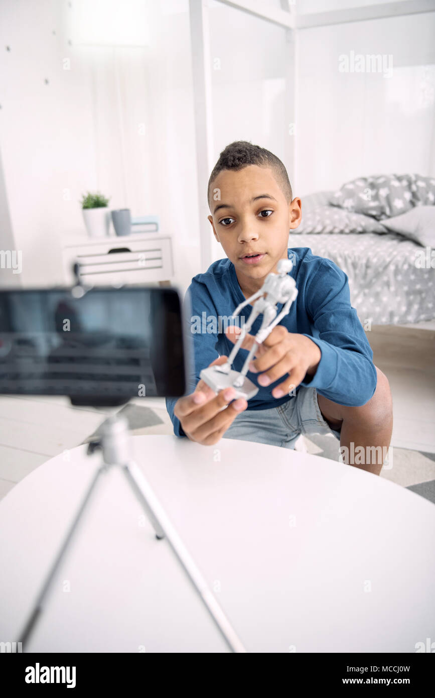 Smart boy blogger explaining benefits Stock Photo - Alamy