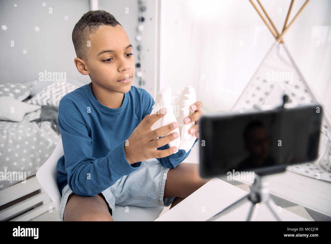 Reflective boy blogger explaining principles Stock Photo - Alamy
