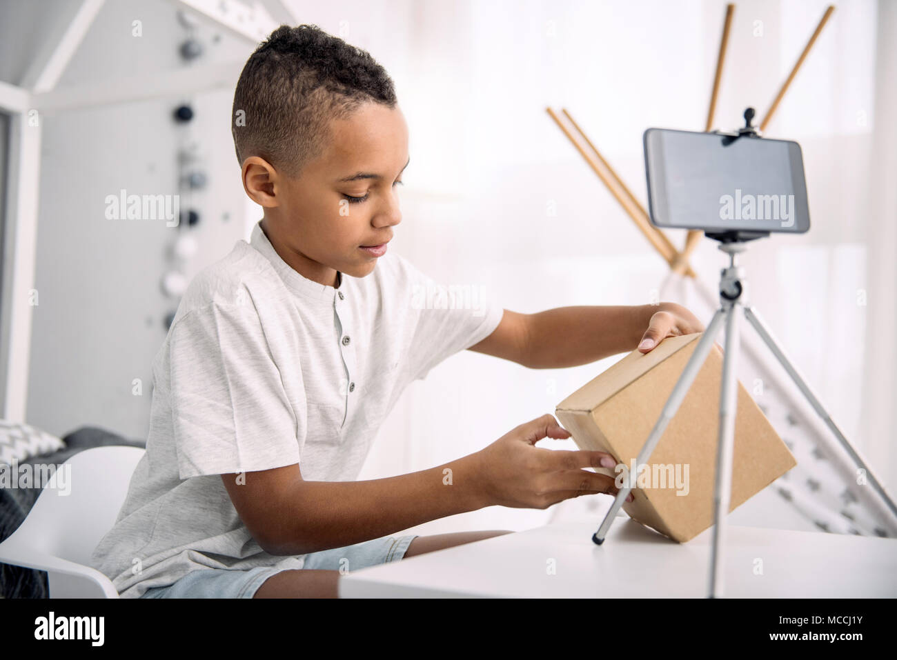 Curious boy blogger starting review Stock Photo - Alamy