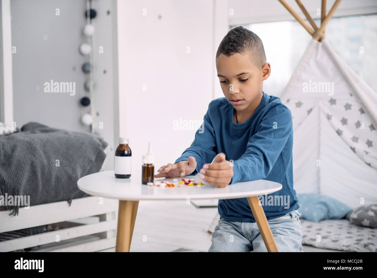 Child taking medication hi-res stock photography and images - Alamy