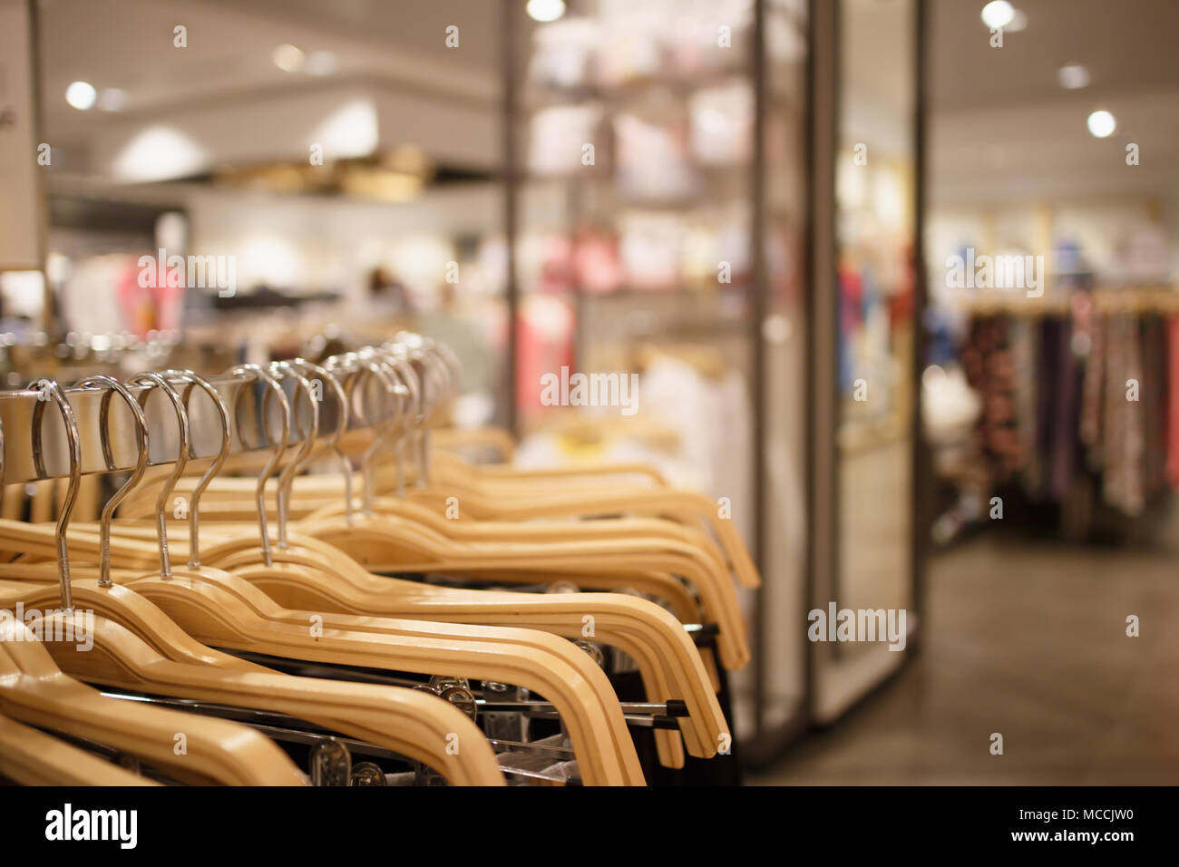 clothes on a hanger in a store. Shopping mall Stock Photo - Alamy