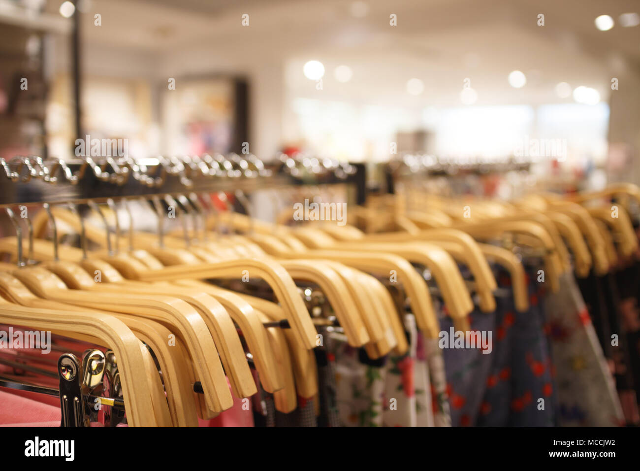 clothes on a hanger in a store. Shopping mall Stock Photo - Alamy