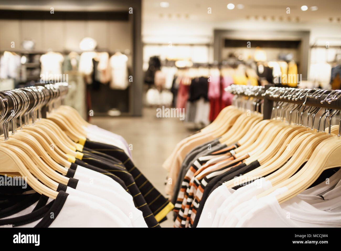 clothes on a hanger in a store. Shopping mall Stock Photo - Alamy
