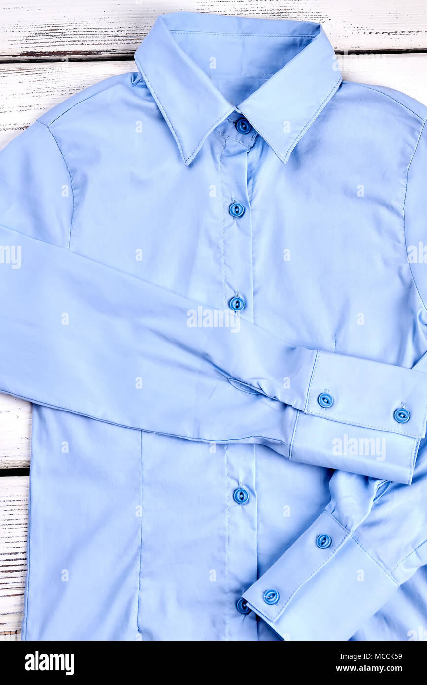 Modern light blue woman shirt. Long sleeve formal blouse, top view ...