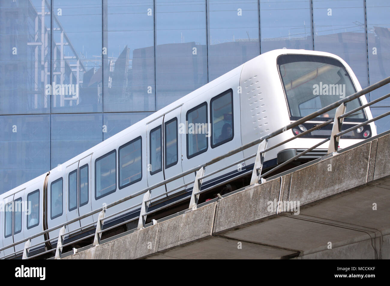Sustainable driverless modern light rail metro train on railroad track ...