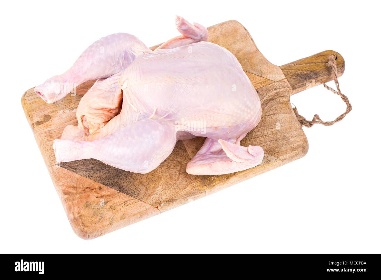 Chicken whole raw on wooden cutting board. Studio Photo Stock Photo - Alamy