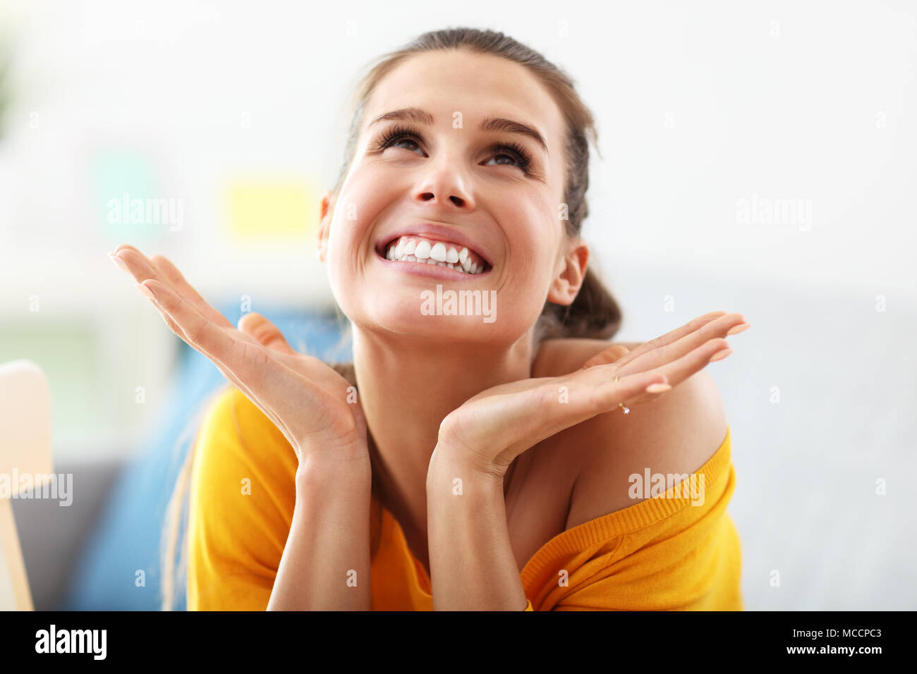 Happy woman relaxing at home Stock Photo - Alamy