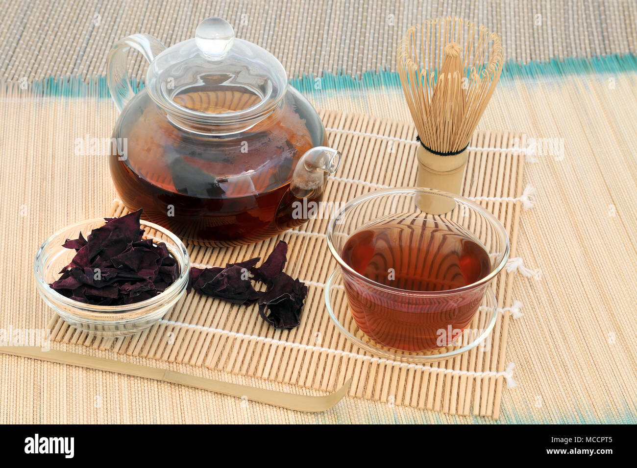 Dulse seaweed tea health drink with glass teapot and tea cup and dried ...