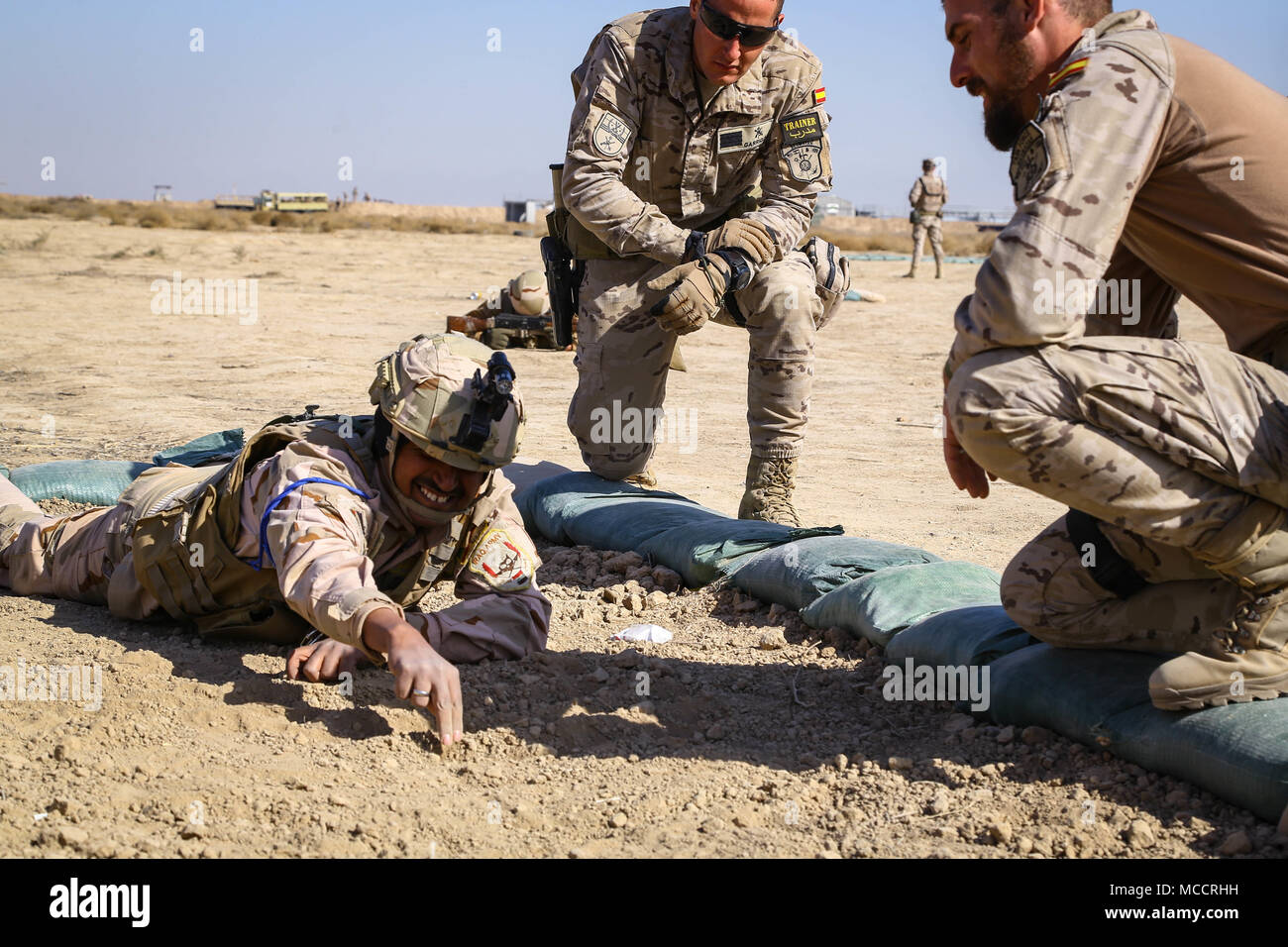 Soldiers attached to 3rd Battalion, 40th Brigade, Iraqi army, go over ...