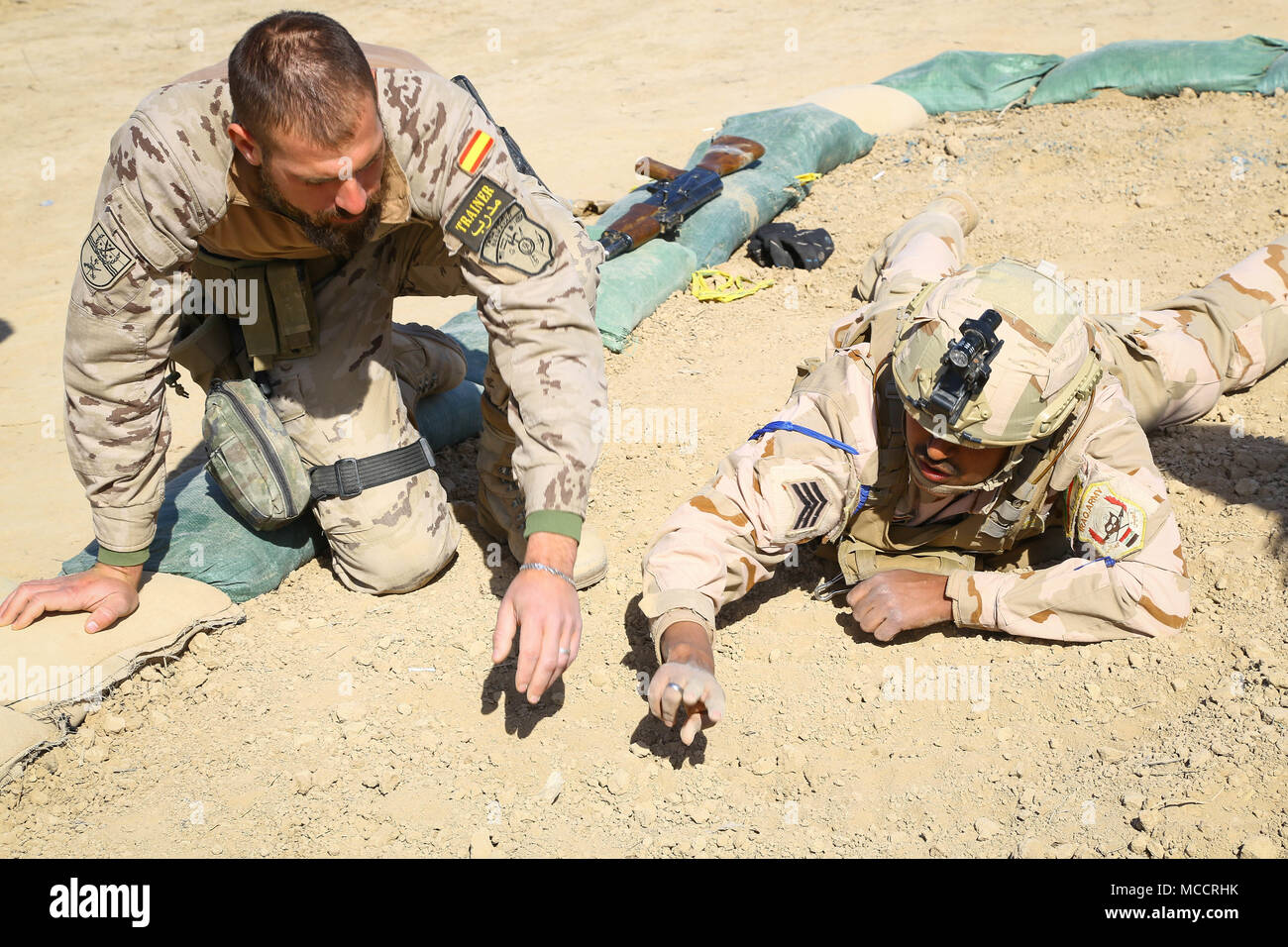 Soldiers attached to 3rd Battalion, 40th Brigade, Iraqi army, go over ...