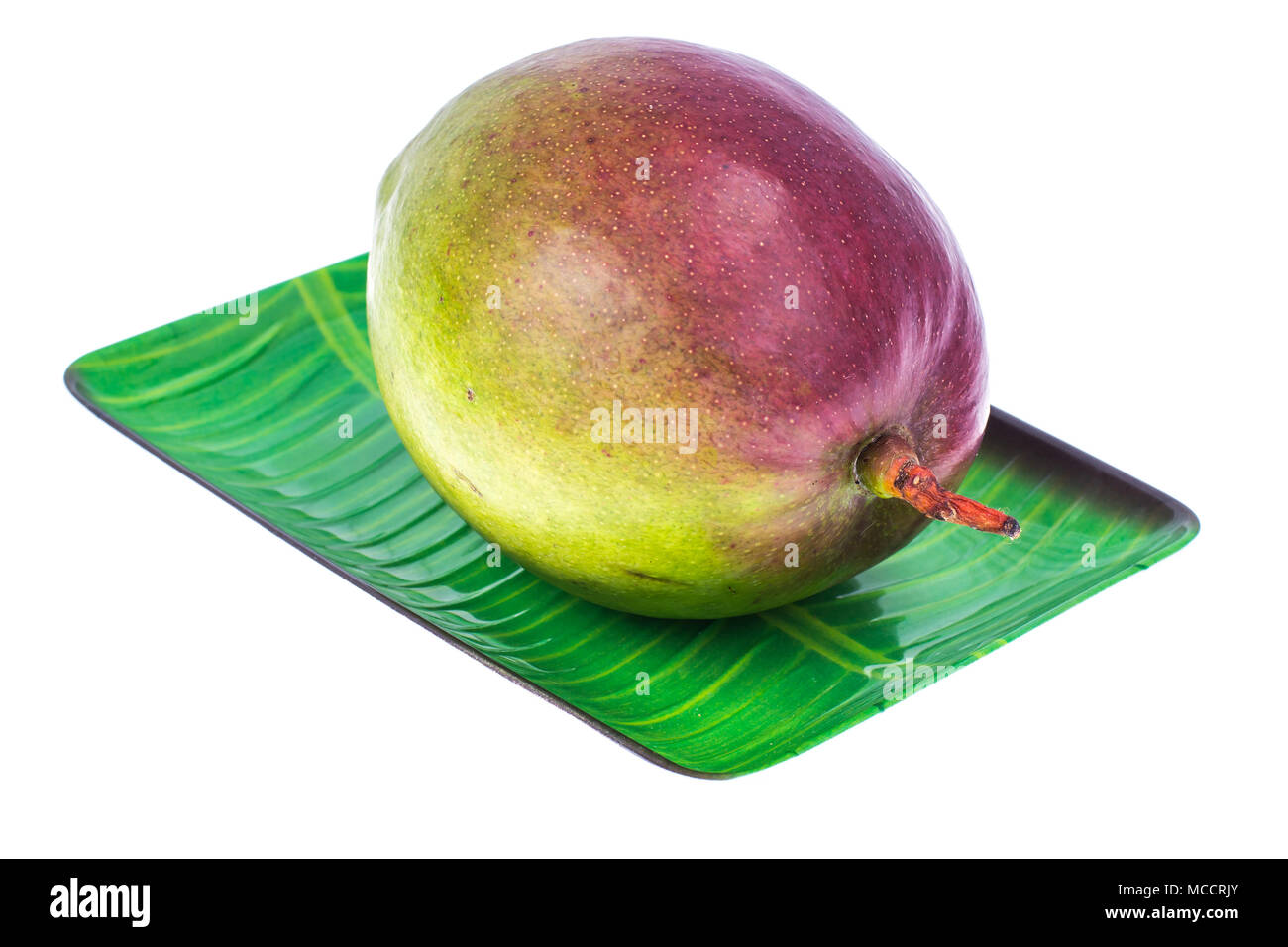 One ripe mango on plate. Studio Photo Stock Photo - Alamy