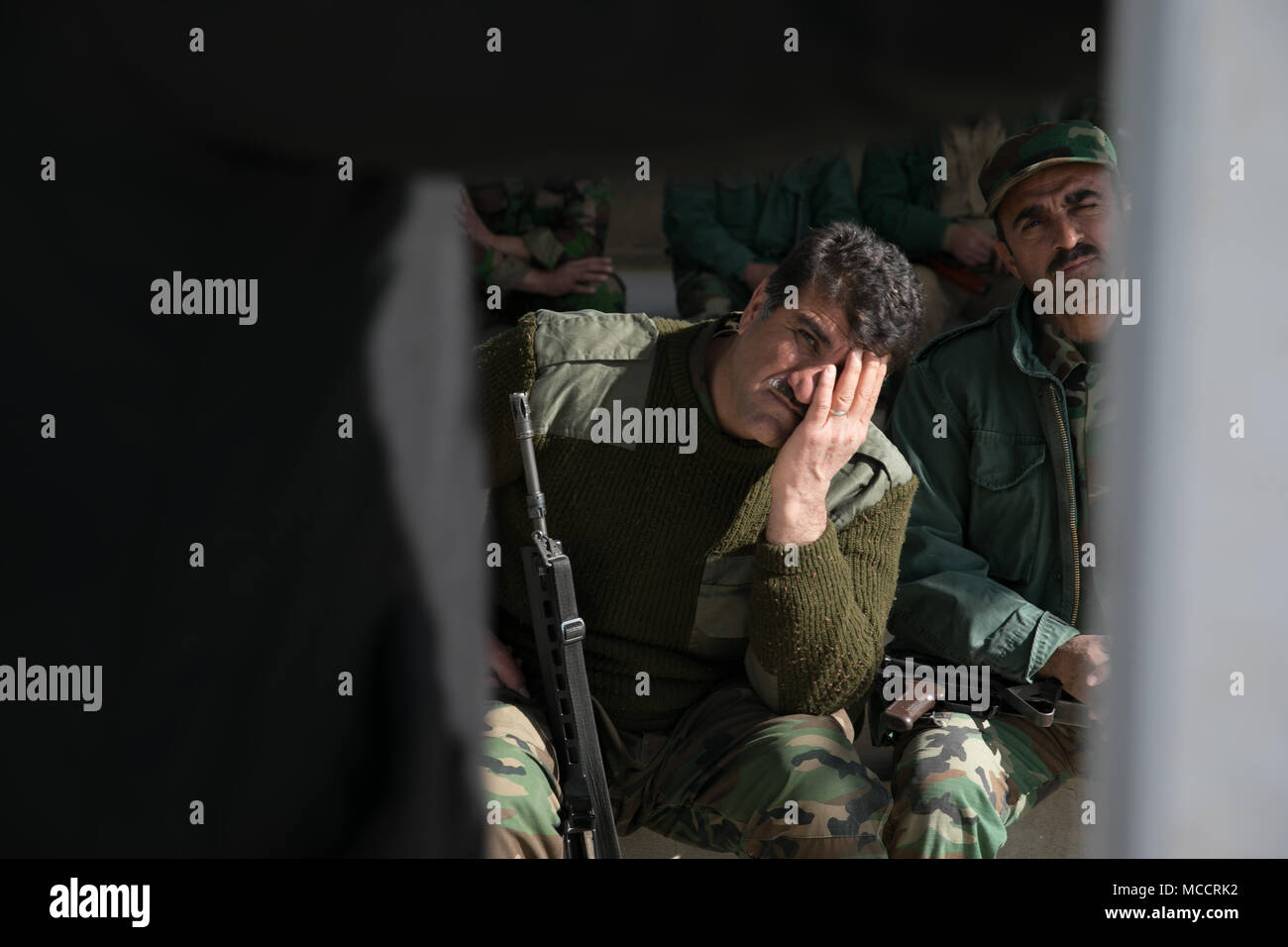 A security force member listens to instructions while learning basic ...