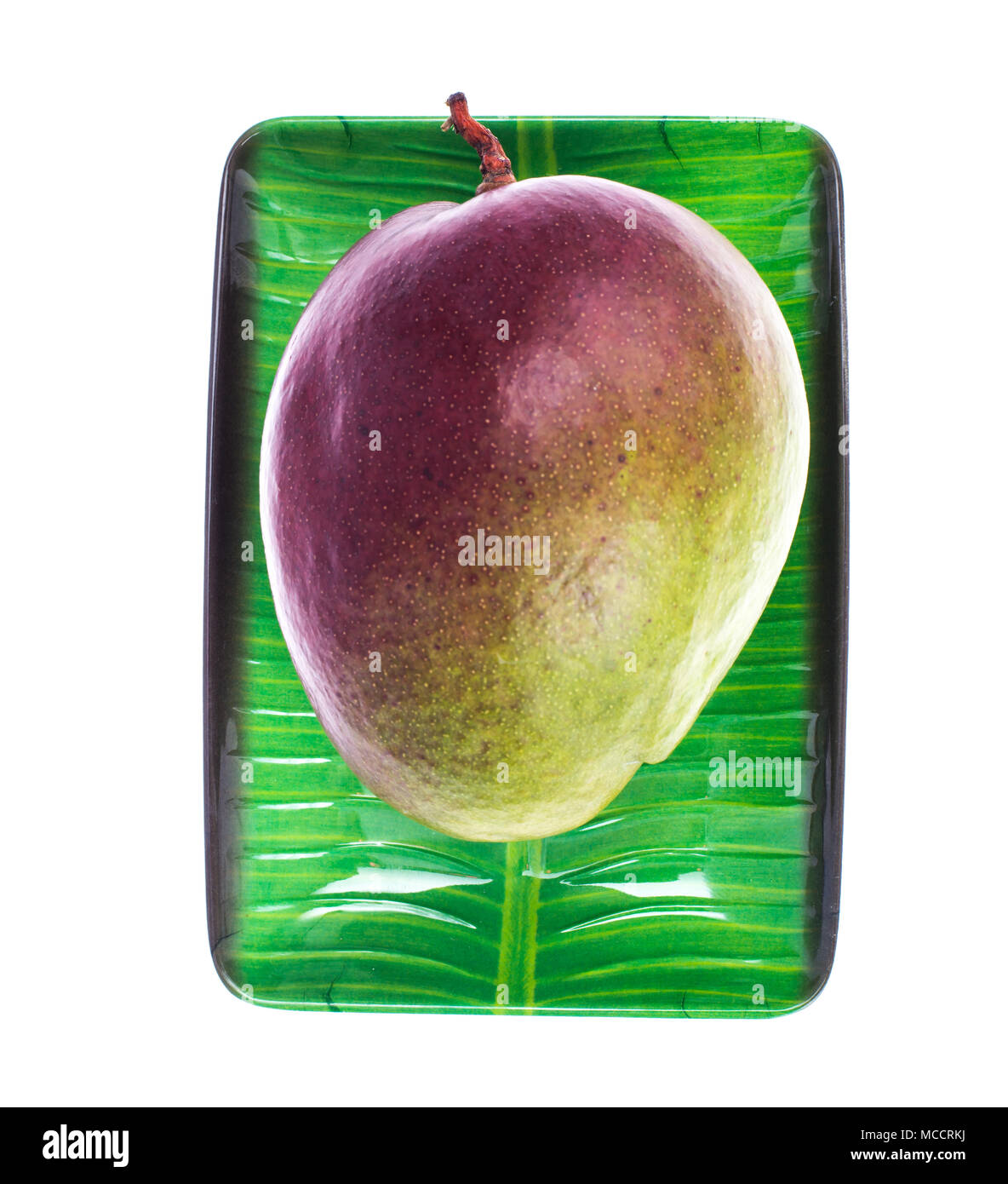 Cut mango on plate Cut Out Stock Images & Pictures - Alamy