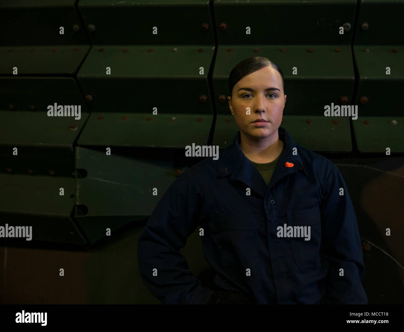 U.S. Marine Lance Cpl. Emilee Russell stands next to her vehicle aboard the amphibious assault ...