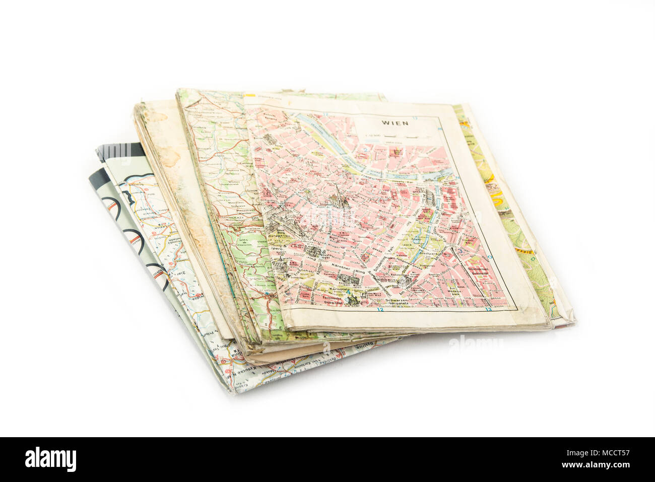Pile of used maps with Vienna one on the top on the white Stock Photo ...