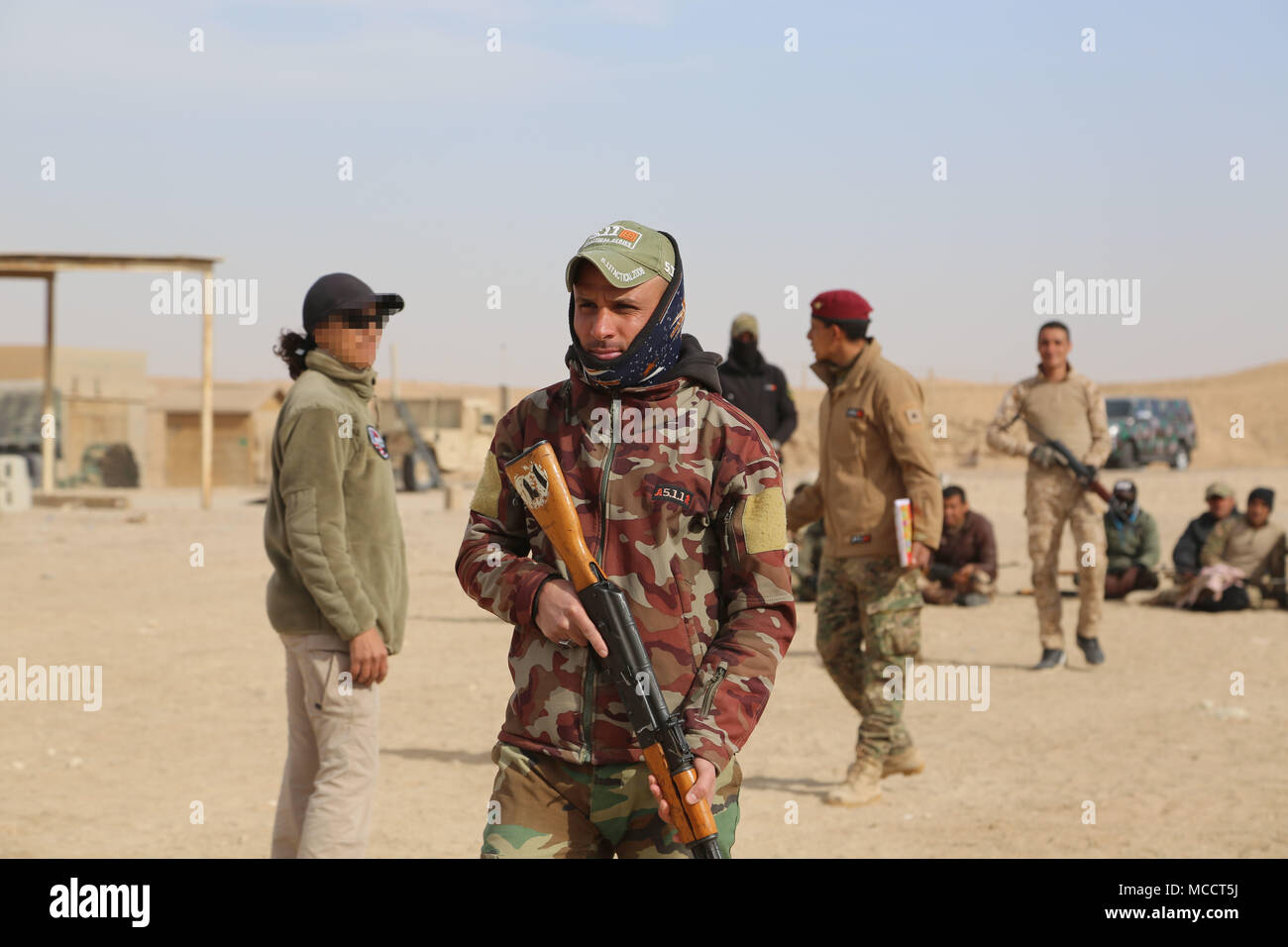 Soldier assigned to the Desert Battalion, Iraqi army, practice the ...
