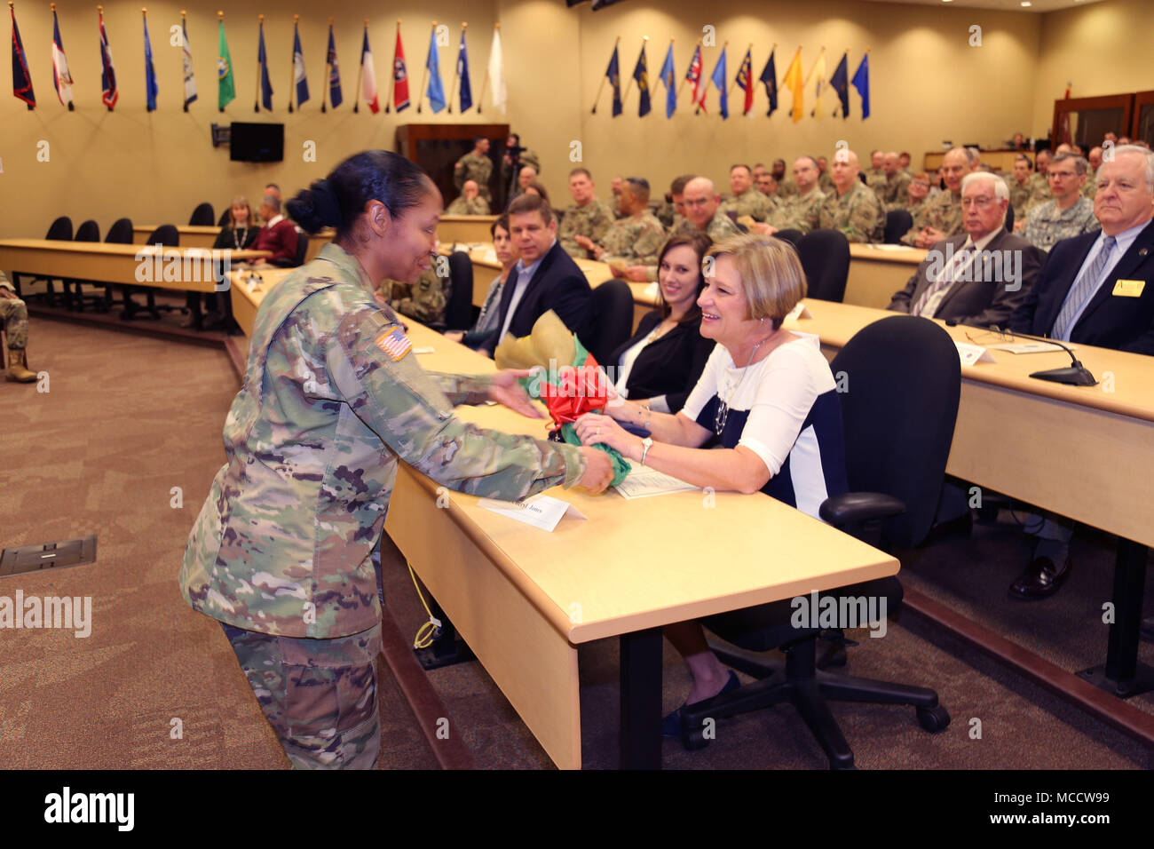 Flowers are presented to Maj. Gen. Jones' wife, Cheryl, during the 81st ...