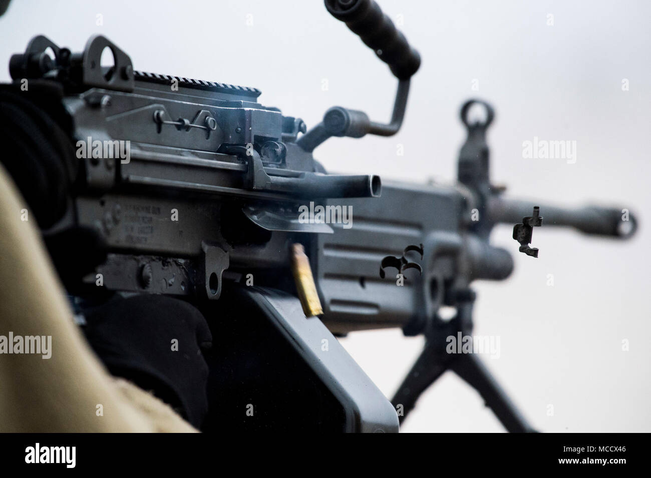An 890th Missile Security Forces Squadron security forces member lights ...