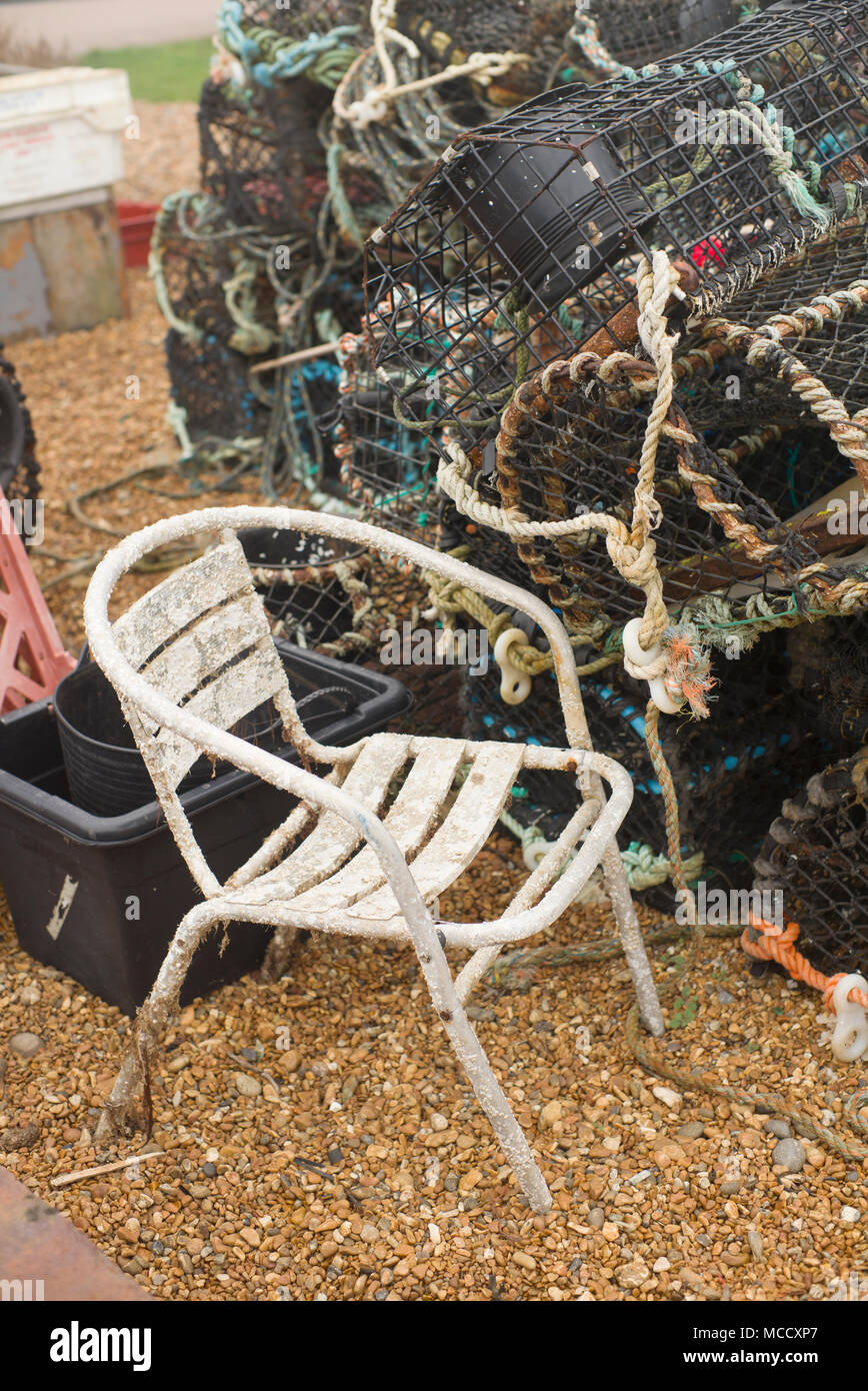 Old chair and lobster pots on the beach Stock Photo - Alamy
