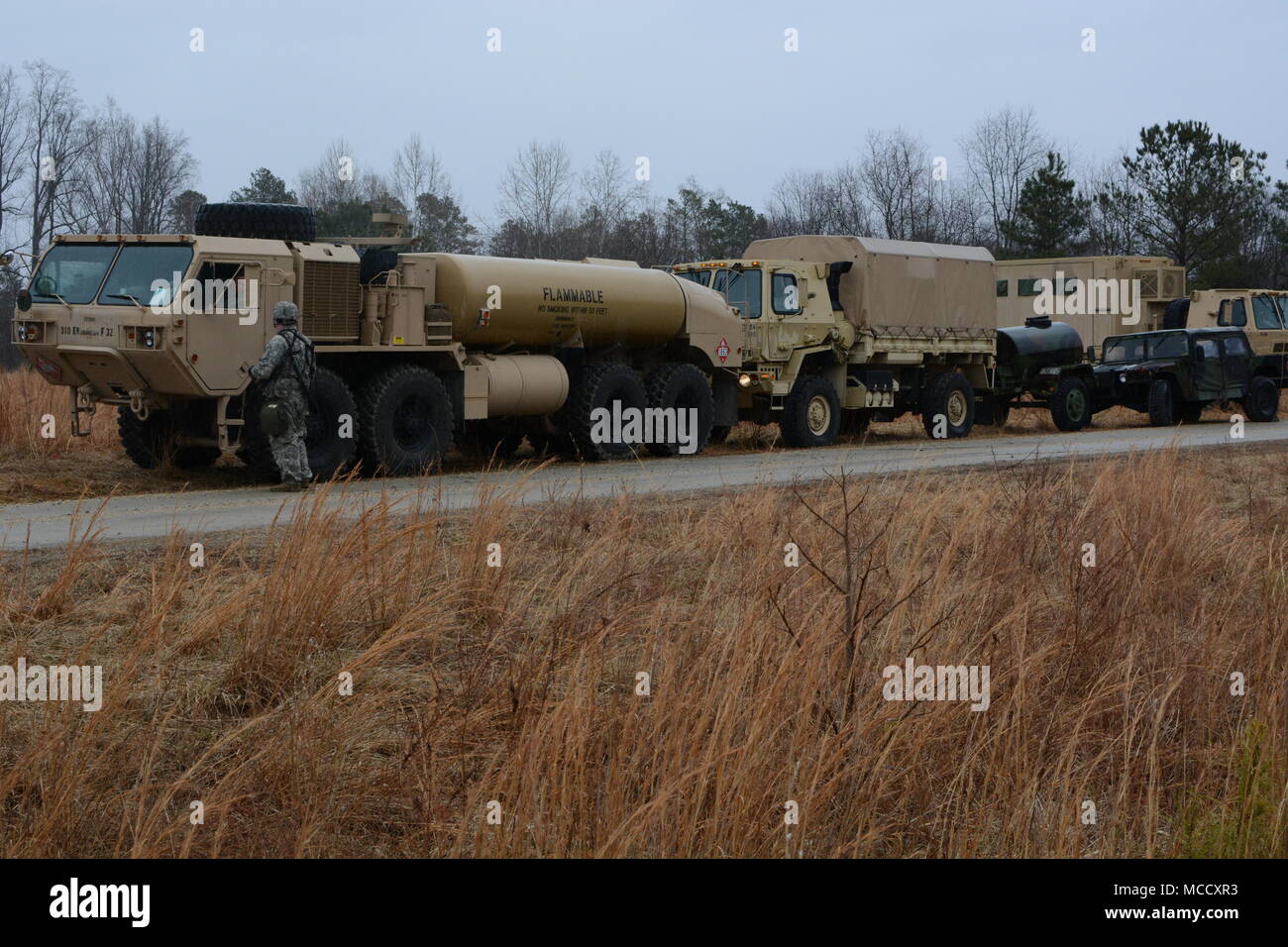 Soldiers of the 55th Sustainment Brigade, stage vehicles in preparation ...