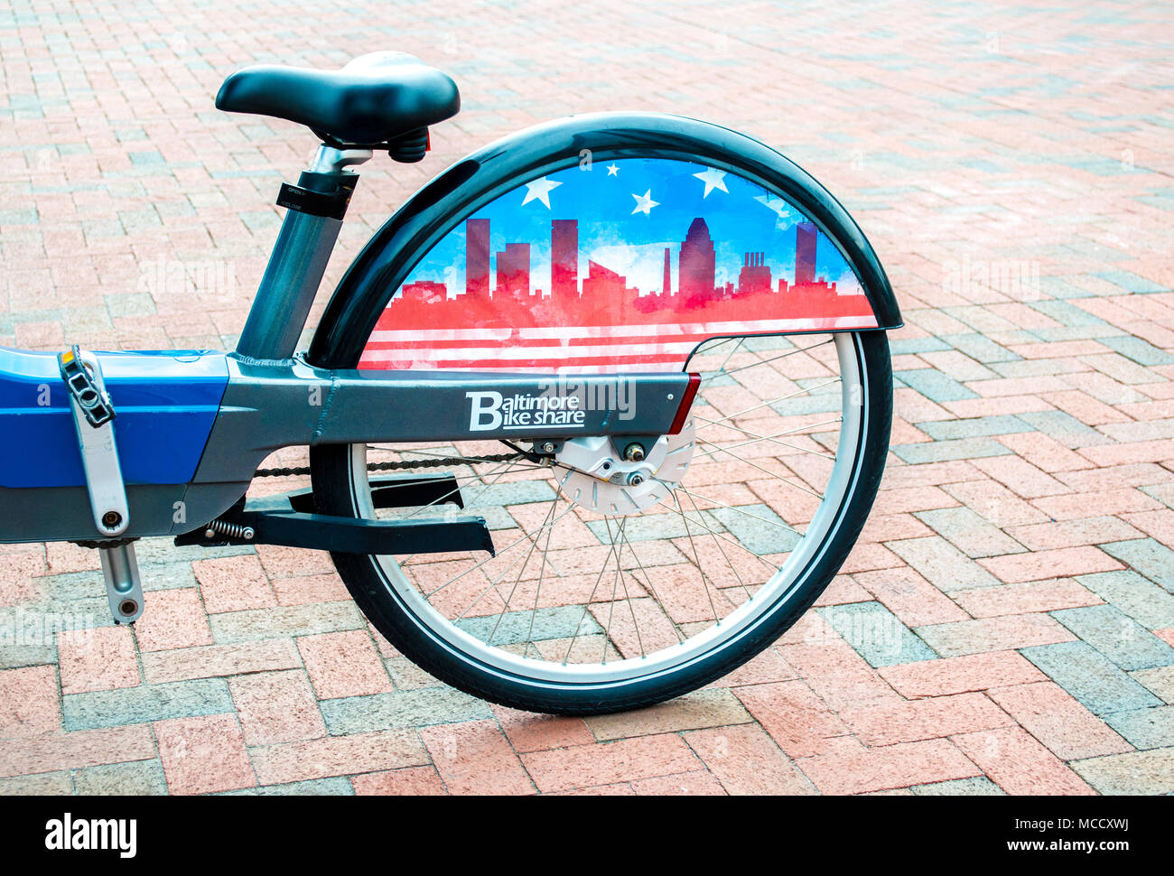 bicycle rear wheel from the Baltimore Bike Share program on a brick ...