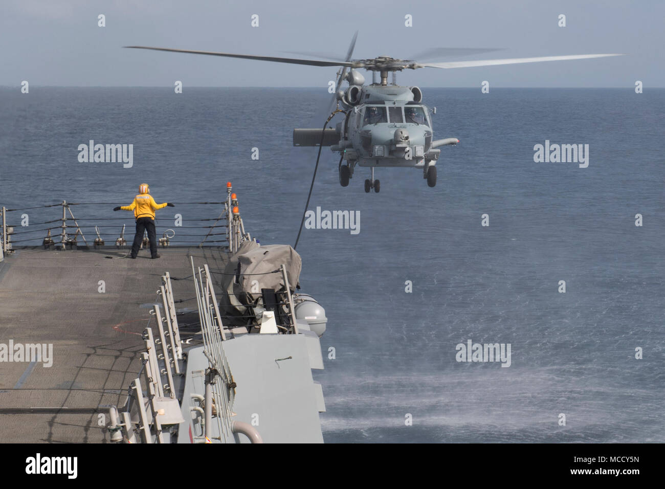 Mh 60 seahawk refueling destroyer hi-res stock photography and images ...